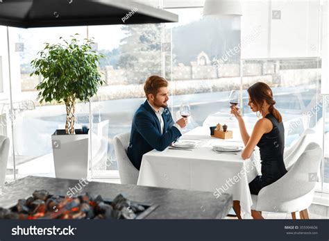 Happy Couple In Love Having Romantic Dinner In Luxury Gourmet