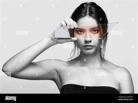 Girl Covers Her Face With A Shard Of The Mirror Female With Mirror
