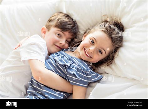 Brother And Sister Having Fun Together On Bed Stock Photo Alamy