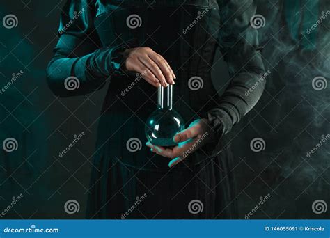 Woman Is A Research Scientist Holding A Flask With The Material