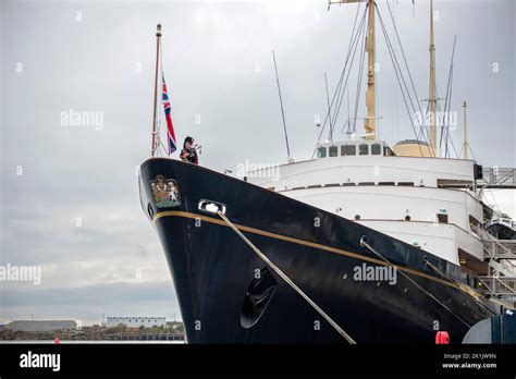 A Piper Plays A Lament Piper Aboard The Royal Yacht Britannia Moored