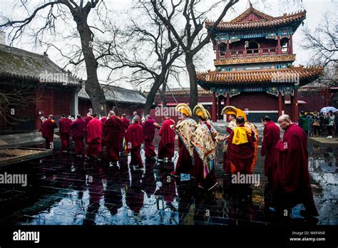 Lamas Are Seen At The Yonghe Temple Also Known As The Yonghe Lamasery Or Lama Temple During A