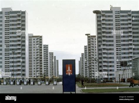 Gateways Lined Up At An Entrance To The Olympic Village Which Has Tower