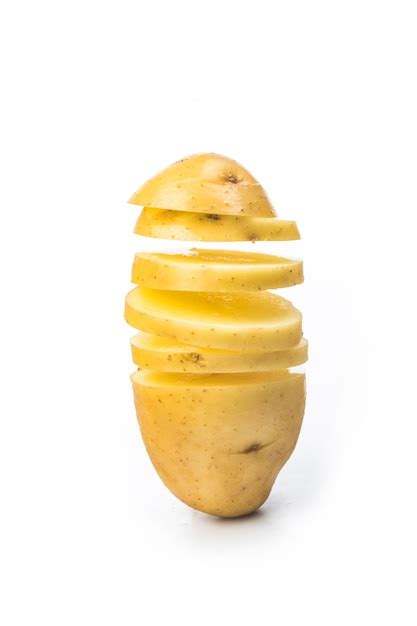 Premium Photo Potato Slices Turning Into Chips Isolated On White