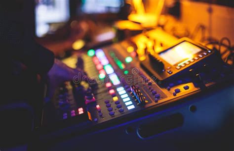View Of Lighting Technician Operator Working On Mixing Console Workplace During Live Event