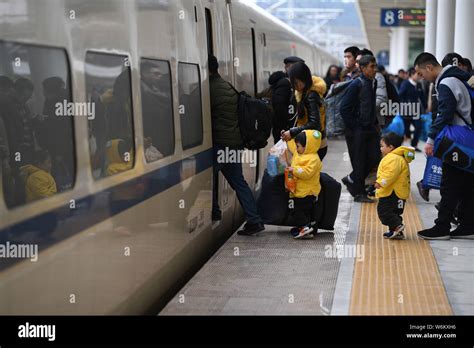 Passengers Enter A Crh China Railway High Speed Bullet Train At The