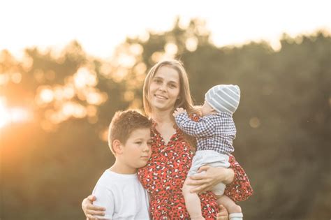 Premium Photo Happy Mother With Son Enjoying Nature On Sunny Day Shot