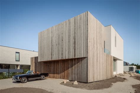 Wooden Cladding And Lime Plaster Cover The Solid Form Of Villa K340 In