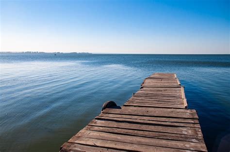 Premium Photo Old Wooden Plank Platform On The Lake