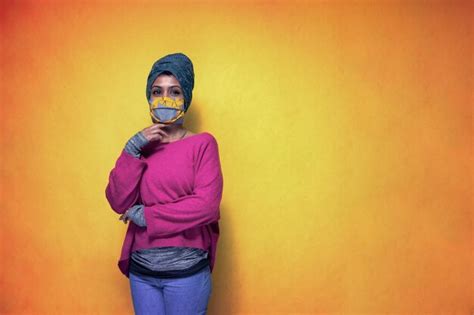 Premium Photo Beautiful Young Indian Woman Posing With Covid 19 Mask