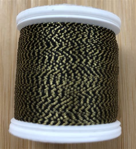 Yli Silk Sparkle Gold Black 100m 758549510169