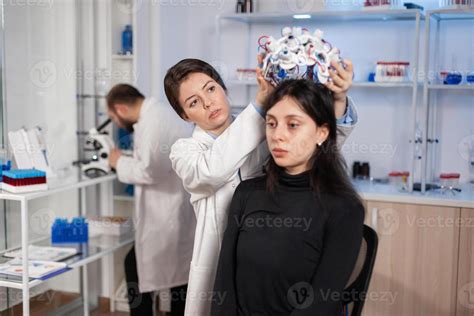 Medical Lab Technician Putting Eeg Headset Monitoring Brain Functions
