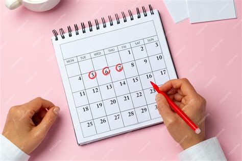 premium photo calendar with marked dates of menstrual days