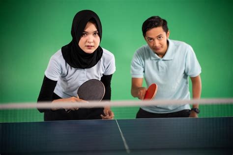 Premium Photo Veiled Female And Male Ping Pong Players Ready To Play