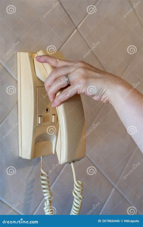 View Of Woman Hand Holds The Intercom Receiver Headset Stock Photo Image Of Call Electronic