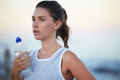 Sports Woman And Bottle For Break Exercise And Running Outdoors In Nature Thinking Fatigue
