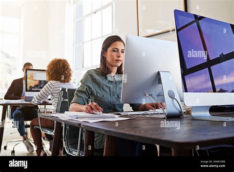 Technology Ensures Their Workday Is A Productive One Shot Of Colleagues Working On Their