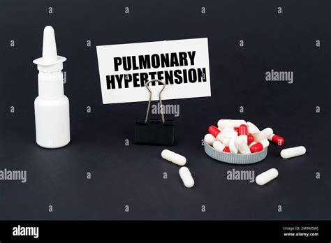 Medical Concept On The Black Surface Of A Pill A Nasal Spray And A