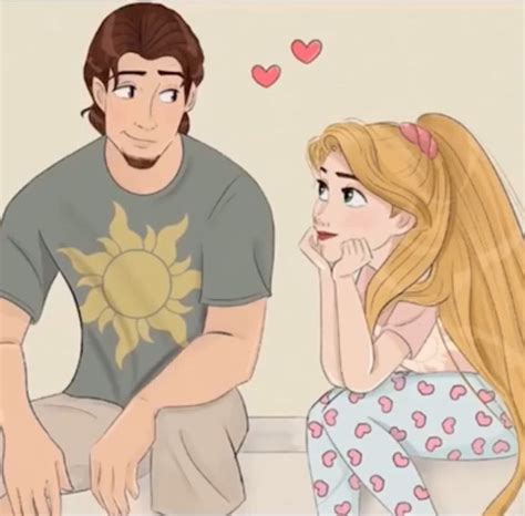 A Man And Woman Sitting Next To Each Other