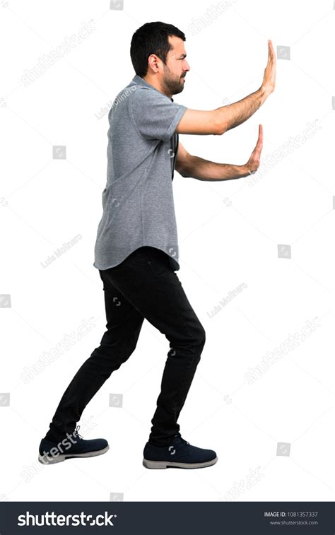 Handsome Man Pushing Something Stock Photo Edit Now