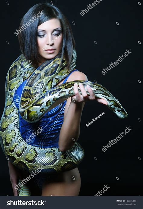 Sexy Brunette Holding Python Over Black Background Stock Photo 109976018 Shutterstock