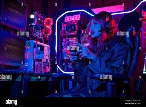 Young Woman Wear Gaming Headphones Playing Esports Games Console Gaming