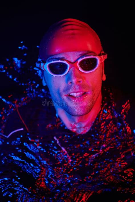 Authentic Triathlete Swimmer Having A Break During Hard Training On