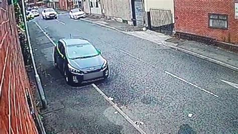 Moment Driver Rams Into Police Car Before Speeding Off Leaving Two