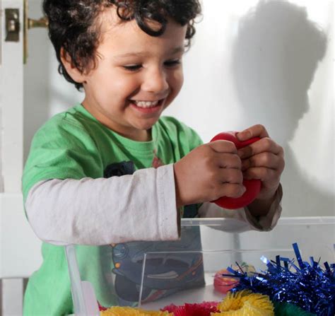 Sensory Play Rainbow Tactile Sensory Bin In The Playroom
