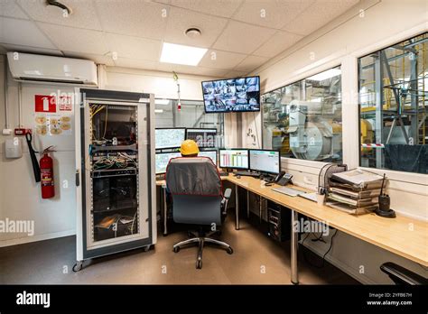 Control Room In An Industrial Facility With Multiple Monitors