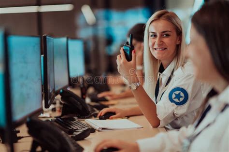 Group Of Security Data Center Operators Working In A Cctv Monitoring