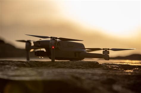 Premium Photo Flying Dji Drone In The Sunset