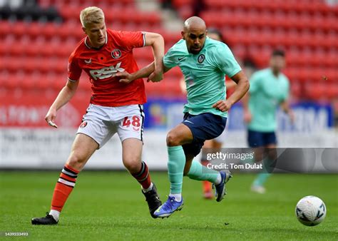 Zach Mitchell Of Charlton Athletic And Ashley Chambers Of Coalville