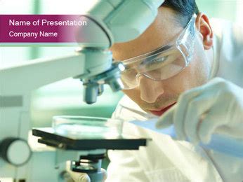 A Man In White Lab Coat And Goggles Looking Through A Microscope PowerPoint Template