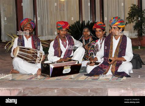Musicians In Traditional Costumes Playing Typical Indian Instruments