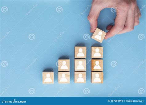 Hand Adding A New Team Member To A Group Business Management Concept