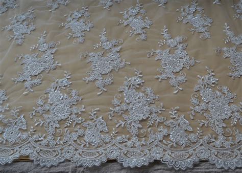 Floral Beaded Corded Lace Fabric Ivory Embroidered Lace Fabric With Wavy Edging