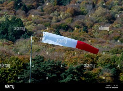 A Windsock Blows In The Wind Indicating Wind Direction And Speed On A