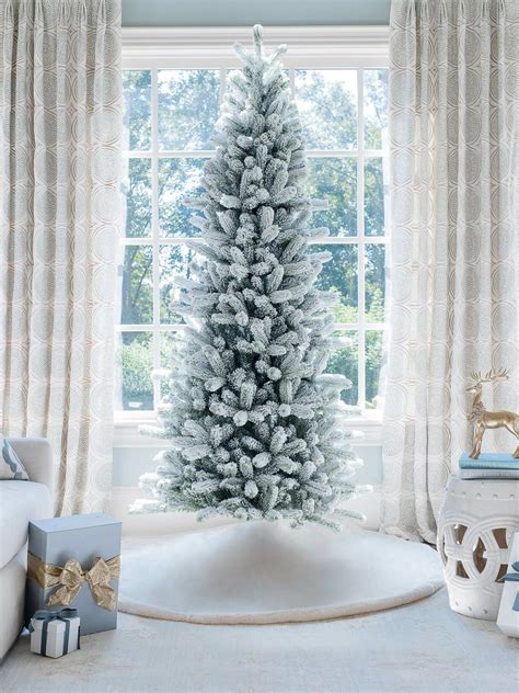 Lighted Christmas Trees In Snow