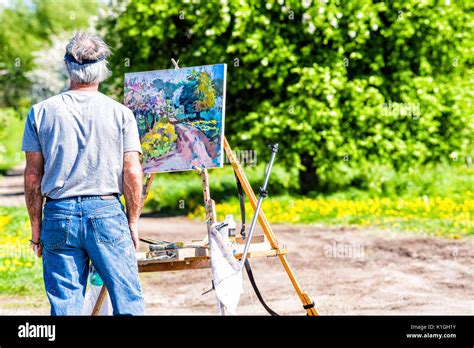 Artist Painting On Easel