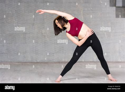 Young Sportive Woman Working Out Young Slim Woman In Sportive Clothing