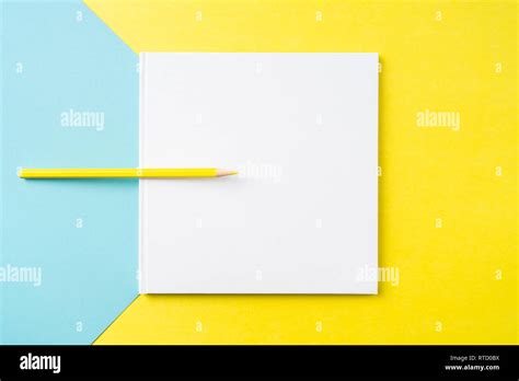 Design Concept Top View Of Square White Notebook And Pen On Colorful