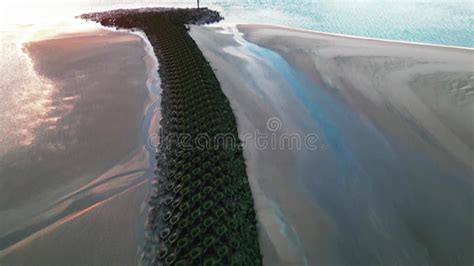Aerial Slow Movement Around New Brighton Beach During Sunset Stock