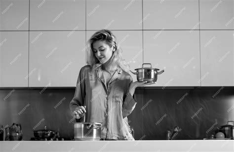 Premium Photo Woman Cooking In A Kitchen Sexy Housewife On Morning Housework