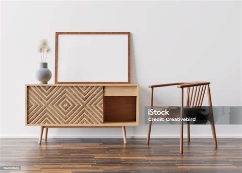 현대 거실의 흰색 벽에 빈 그림 프레임 스칸디나비아 스타일로 인테리어를 모의 여유 공간 사진의 공간을 복사합니다 나무 콘솔과 안락 의자 3d 렌더링 0명에 대한 스톡 사진