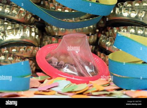 Safer Sex During Carnival And Mardi Gras Condom Between Confetti And