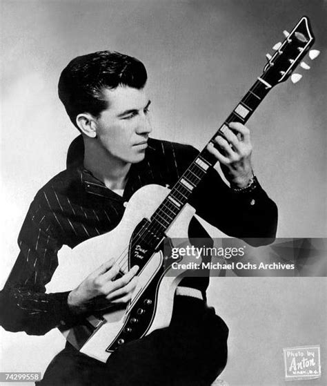Rock And Roll Guitarist Link Wray Plays His Guitar As He Poses For A