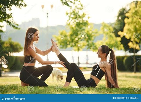 Teaching The New Exercises Two Women In Sport Clothes Are Doing