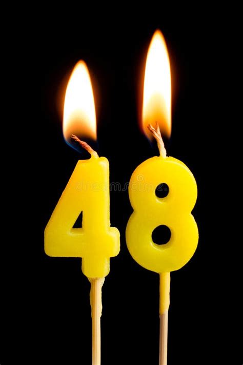 Forty Eight Years Birthday Cupcake With White Burning Candle In The
