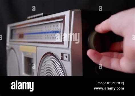 Female Fingers Adjusting The Frequency On An Old Vintage Analog